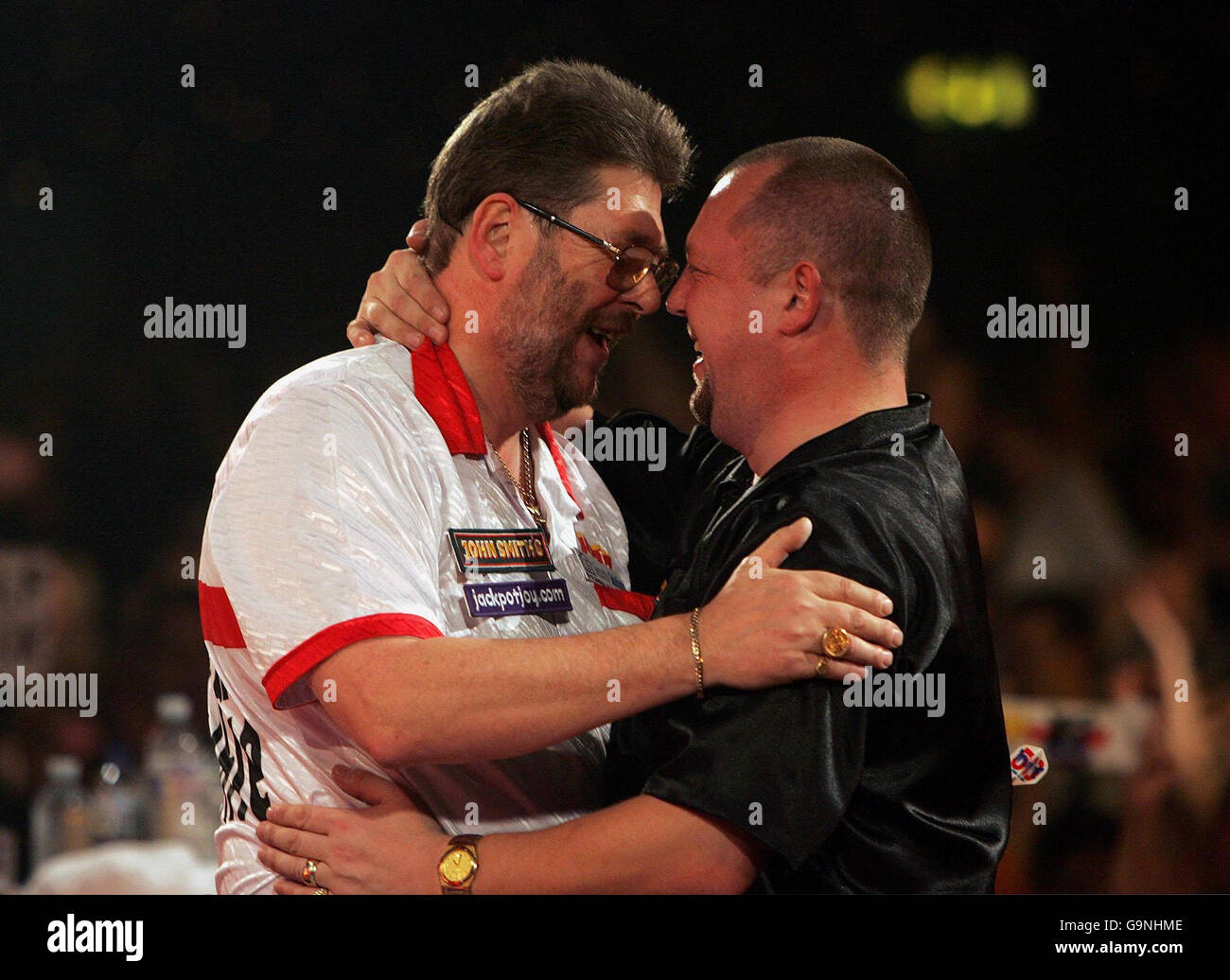 England's Martin Adams (left) hugs Mervyn King after beating him in the ...