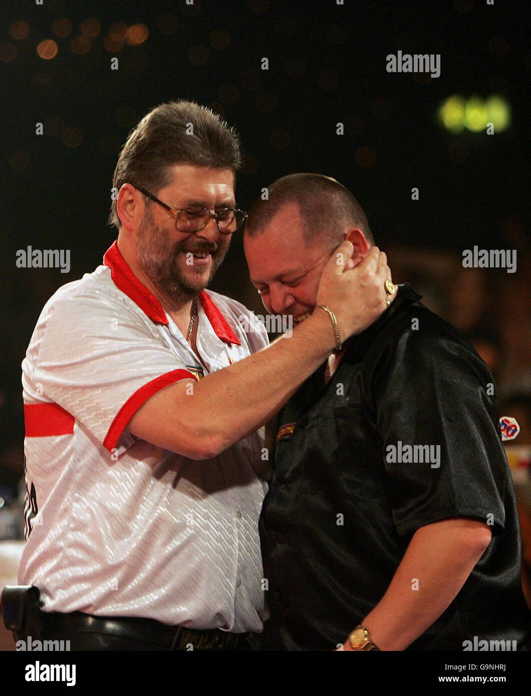 England's Martin Adams (left) hugs Mervyn King after beating him during ...