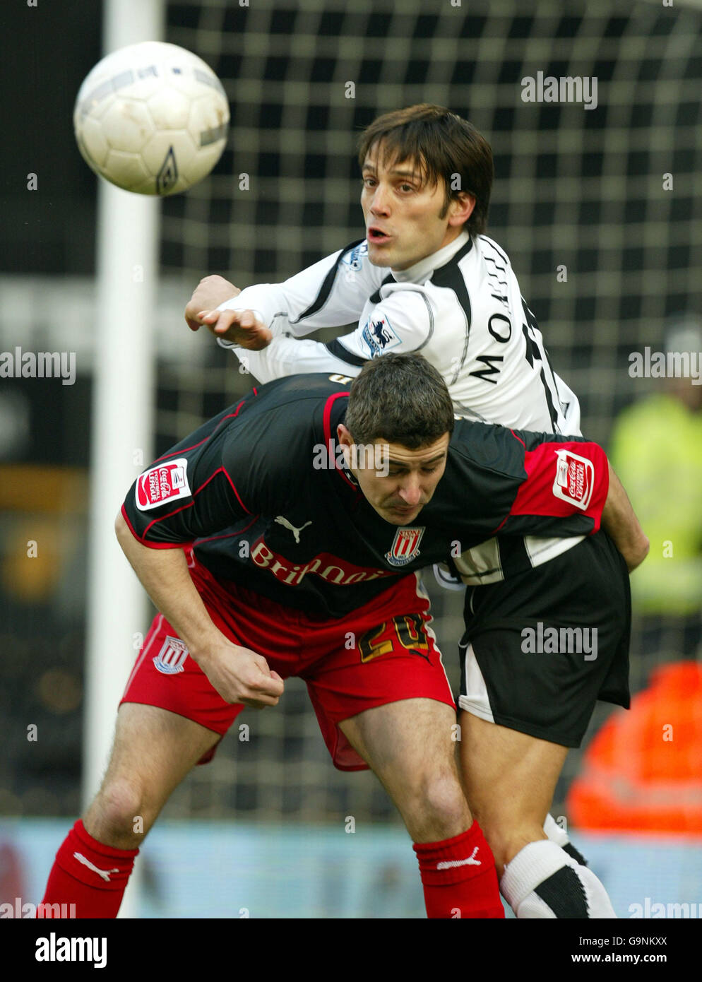 Fulhams' Vincenzo Montella heads the ball past Stoke City's Andy ...