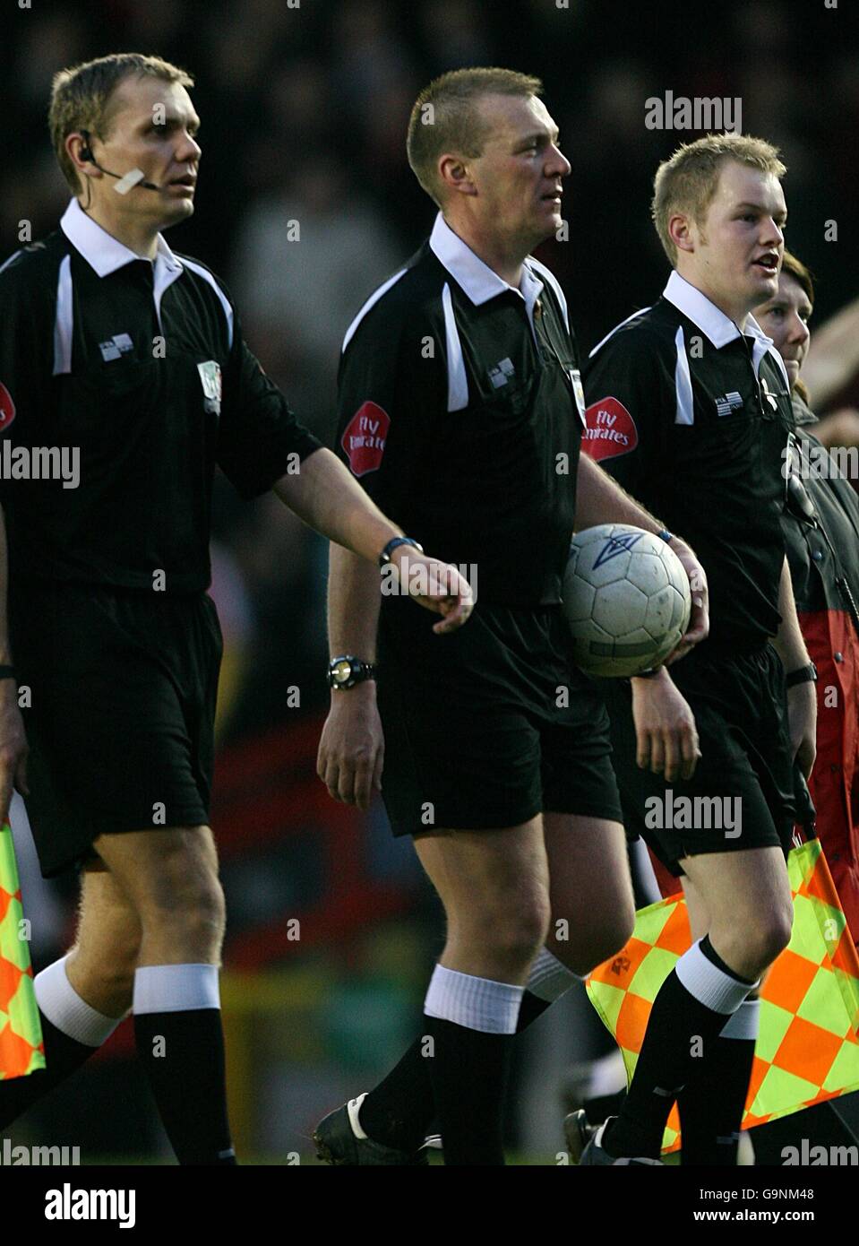 Graham Poll (Centre) and officials walk off at the end of the game ...