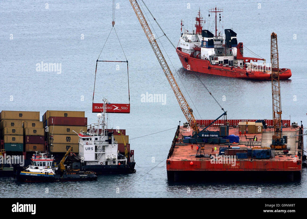 A container is lifted from the grounded cargo ship MSC Napoli and ...