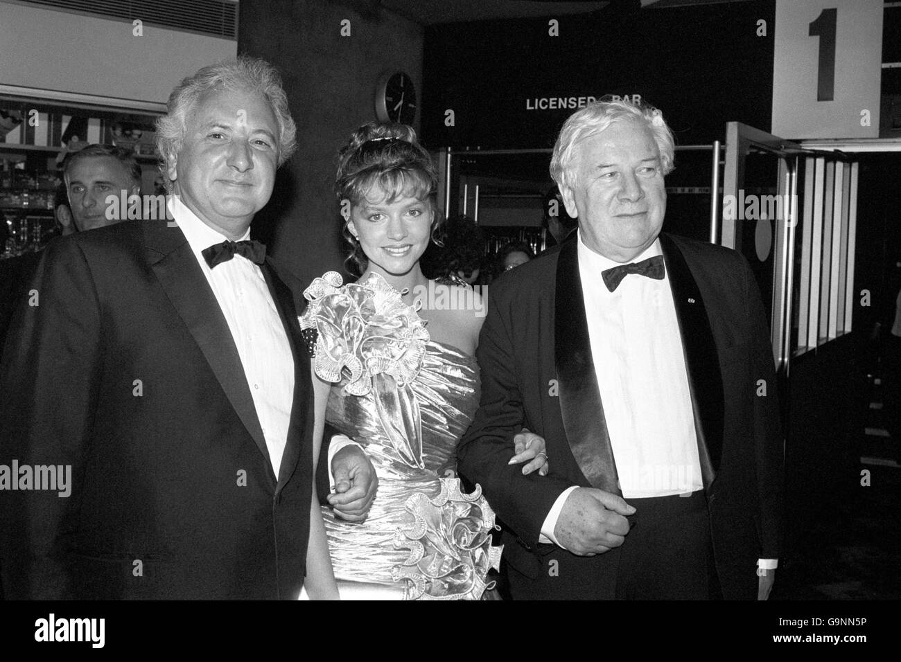 Film director Michael Winner with young British actress Amber Bezer and ...