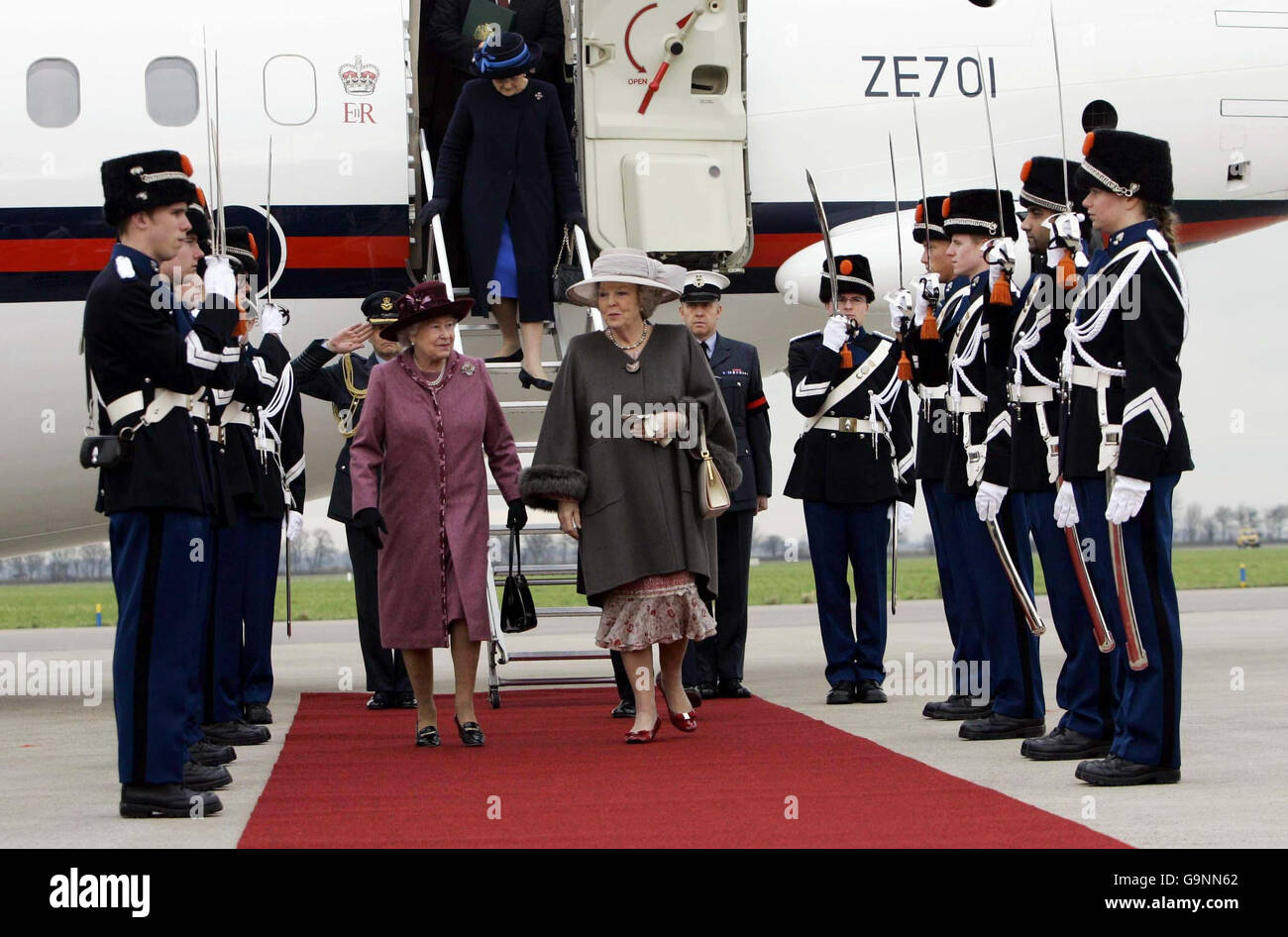 Britain's Queen Elizabeth II (left) is greeted by Queen Beatrix of the ...