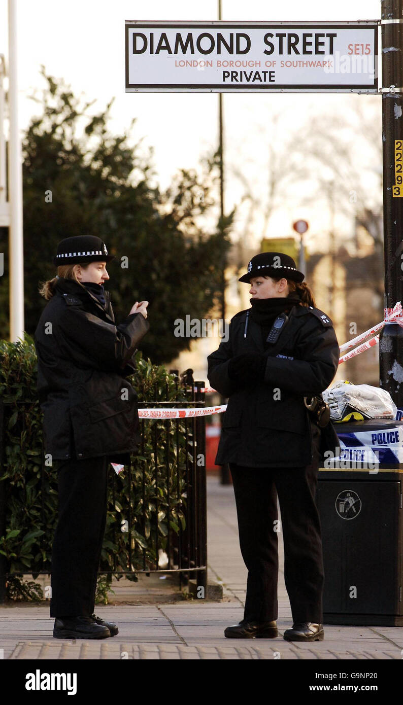 Police stand at the junction of Diamond Street in Peckham, south east ...