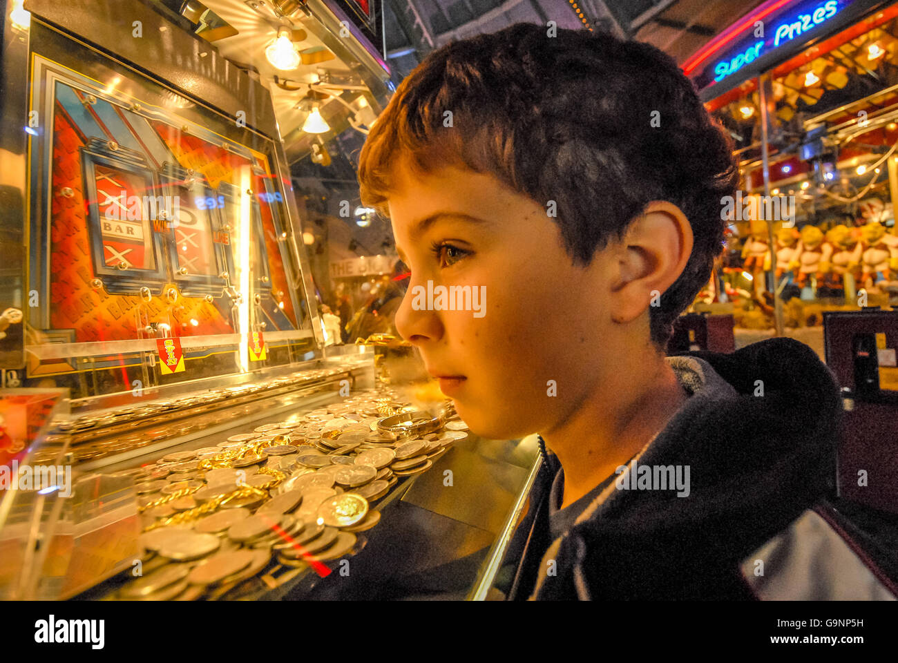 Children playing in a seaside amusement arcade Stock Photo - Alamy