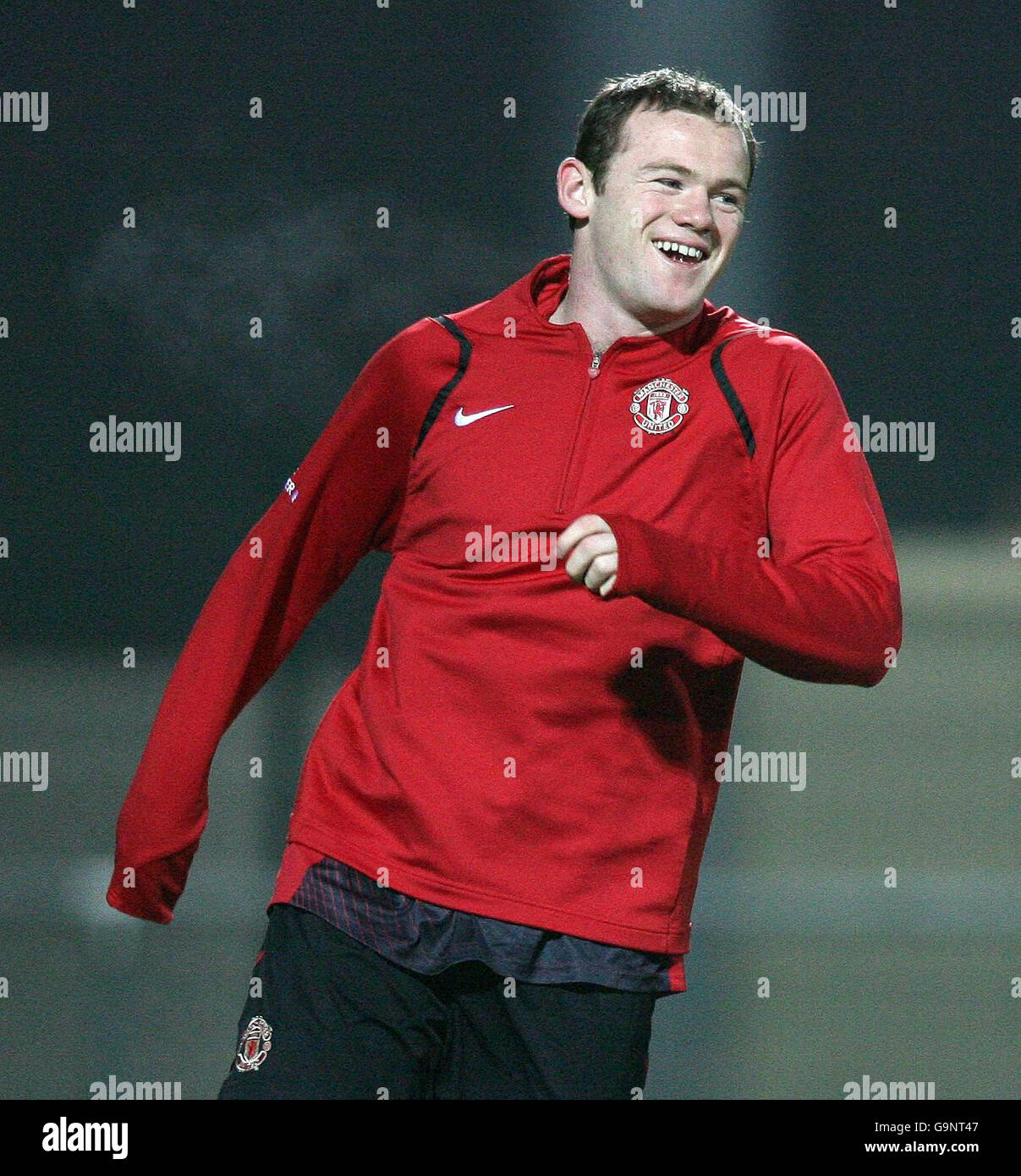 Manchester United's Wayne Rooney laughs during a training session at ...