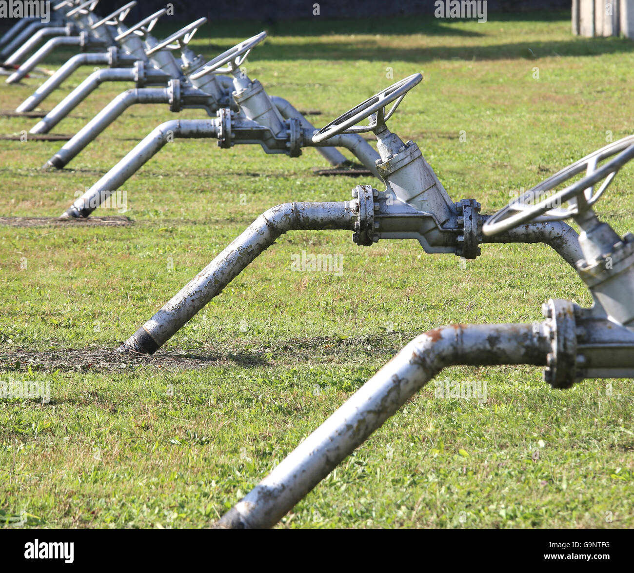 many big gate valves to close or open the natural gas flow in pipeline ...
