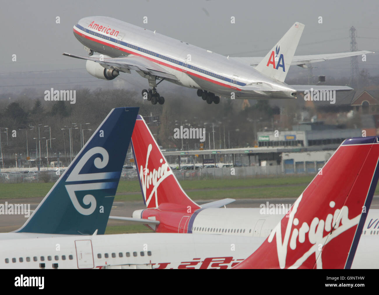 Generic transport pics. An American Airlines Boeing 777 passes two ...