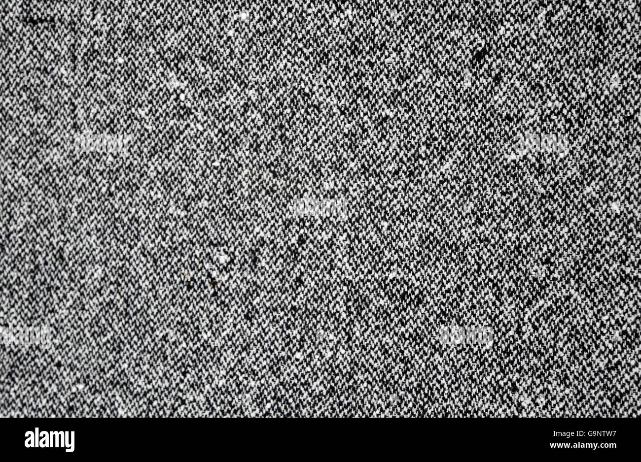 interweaving of black and white color woolen threads obtained with a ...