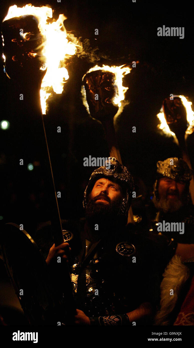 Shetland fire festival. The Jarl Squad march through the streets of ...