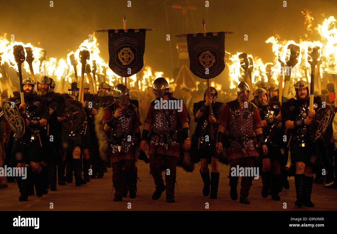 Shetland fire festival. The Jarl Squad march through the streets of ...