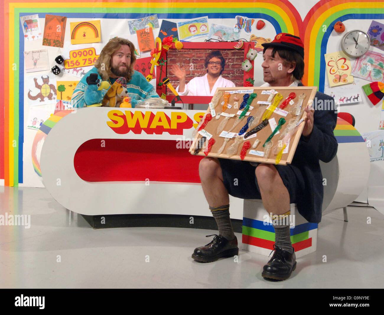 (From left to right) Justin Lee Collins, Alan Carr (on tv screen) and ...