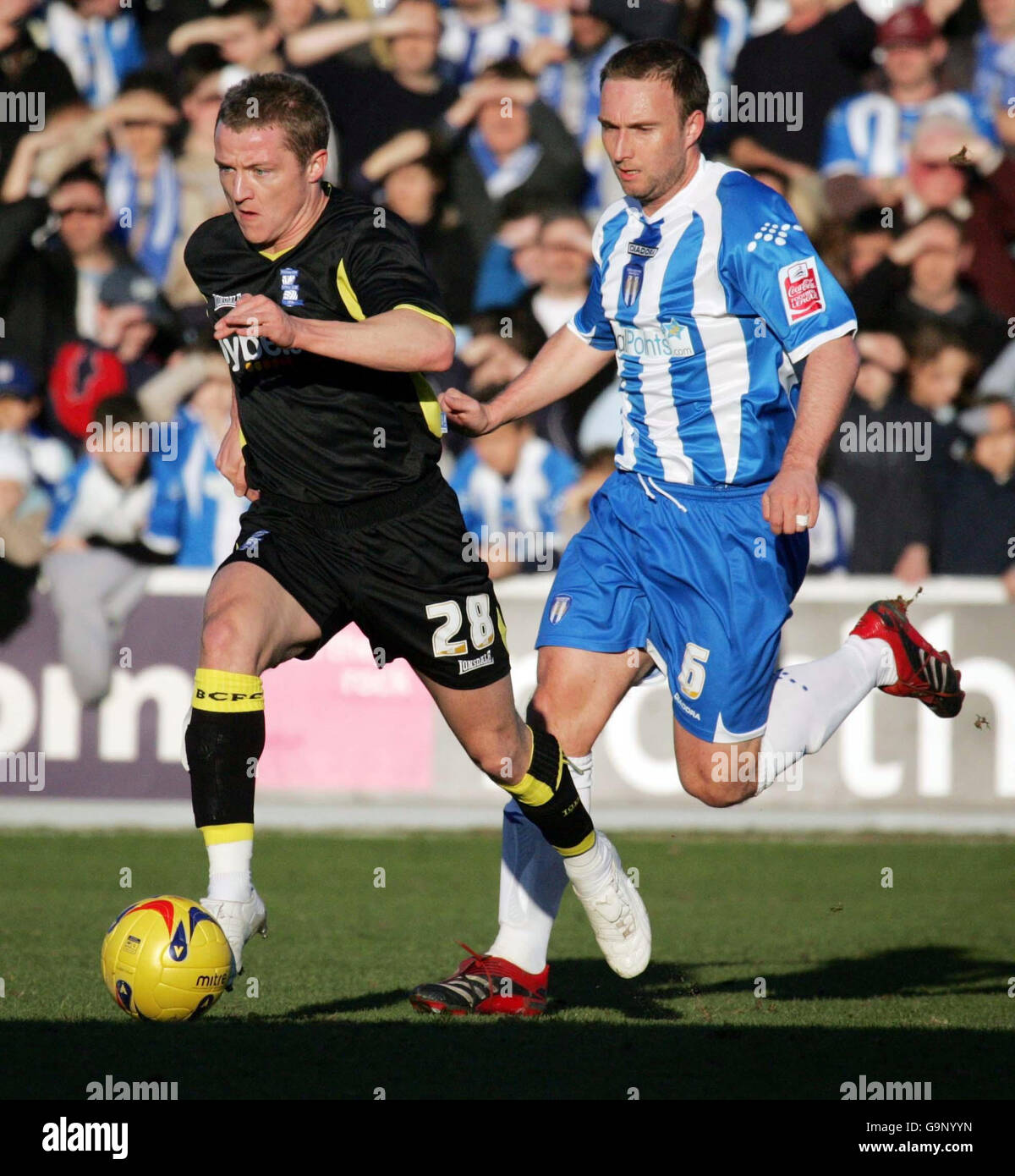 Birmingham's Gary McSheffrey (left) and Colchester's Wayne Brown in ...