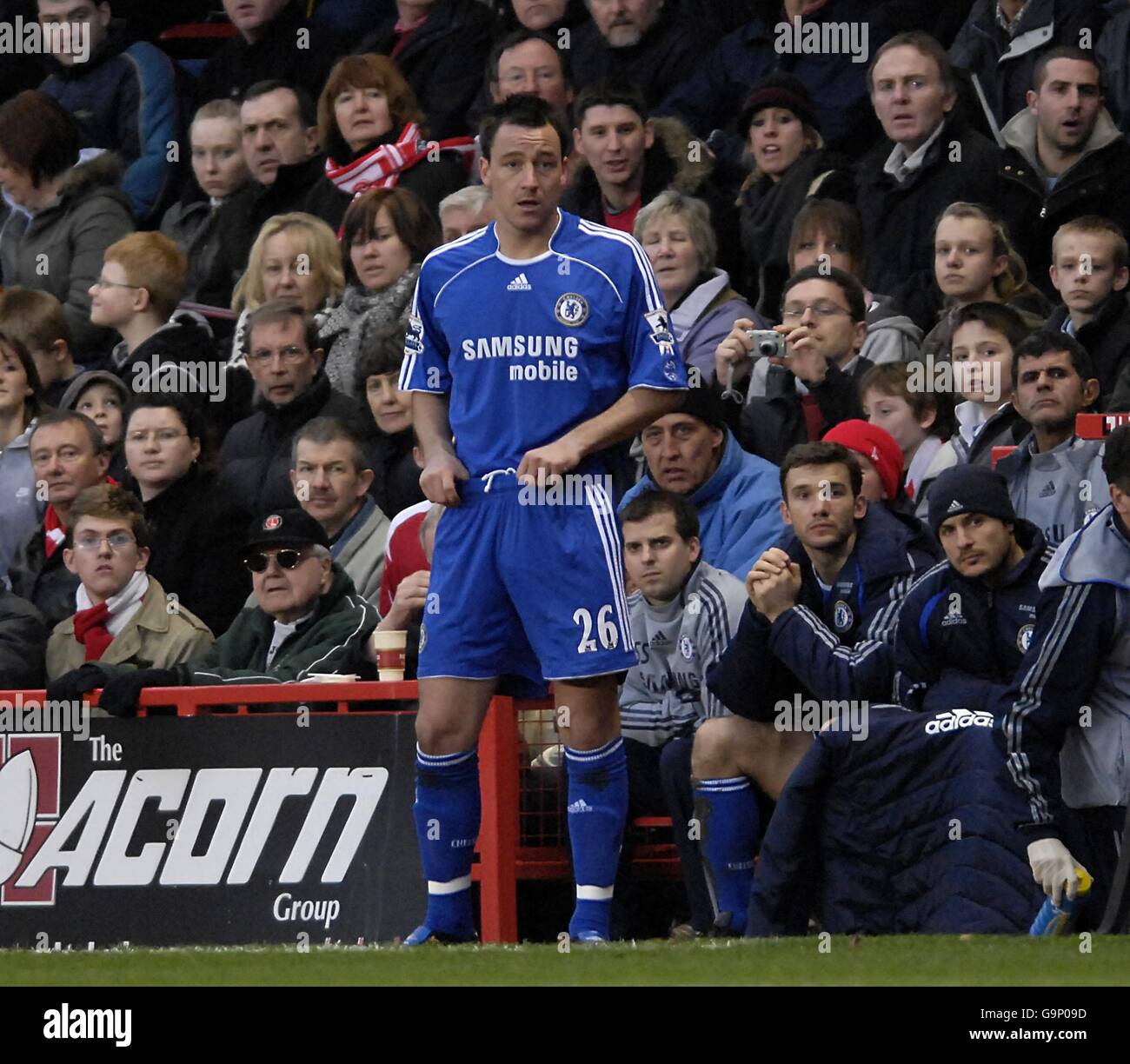 The Chelsea bench look on as John Terry prepares to replace teammate ...