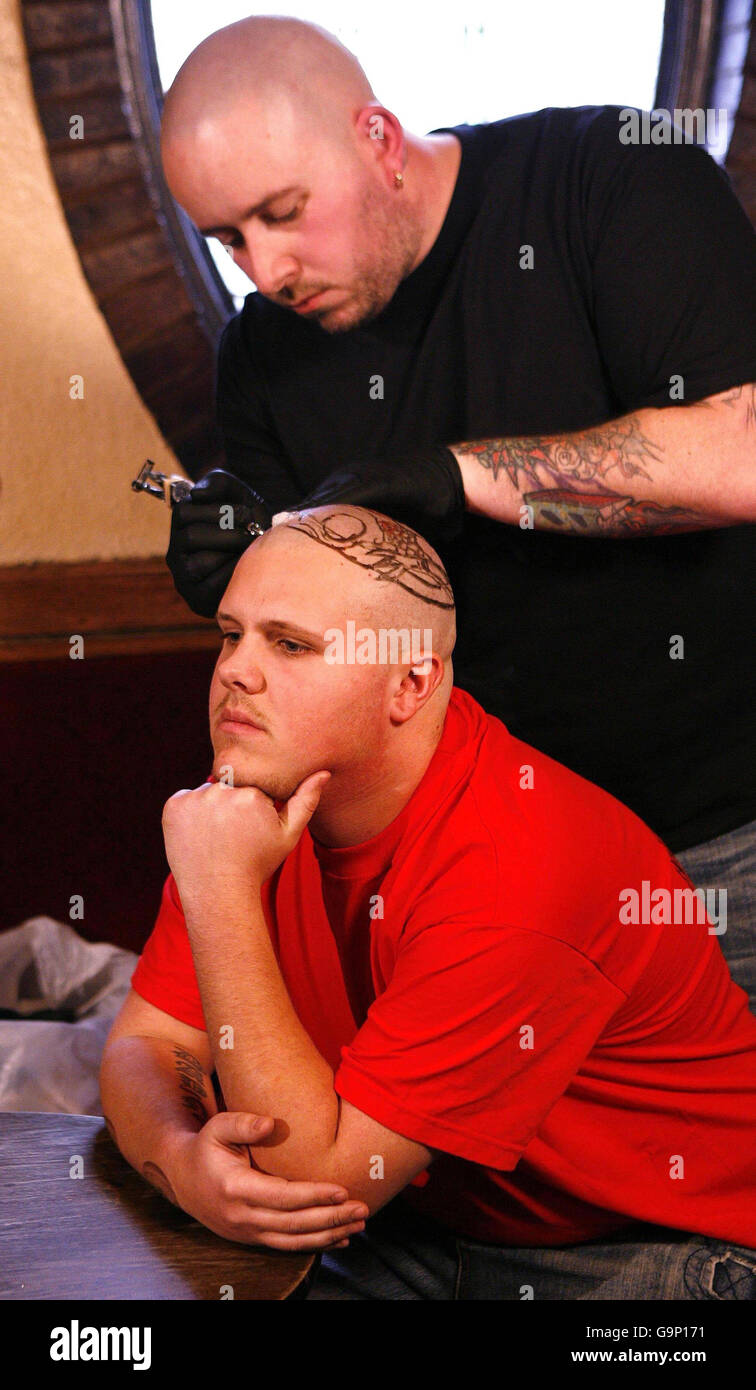 Man has english breakfast tattooed on head hi-res stock photography and ...