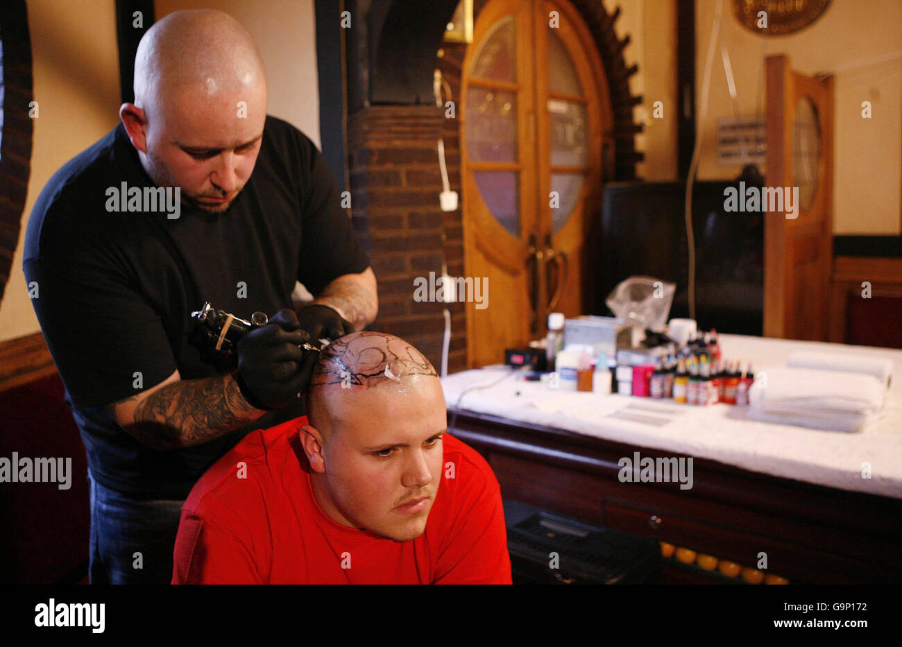 Man has english breakfast tattooed on head hi-res stock photography and ...
