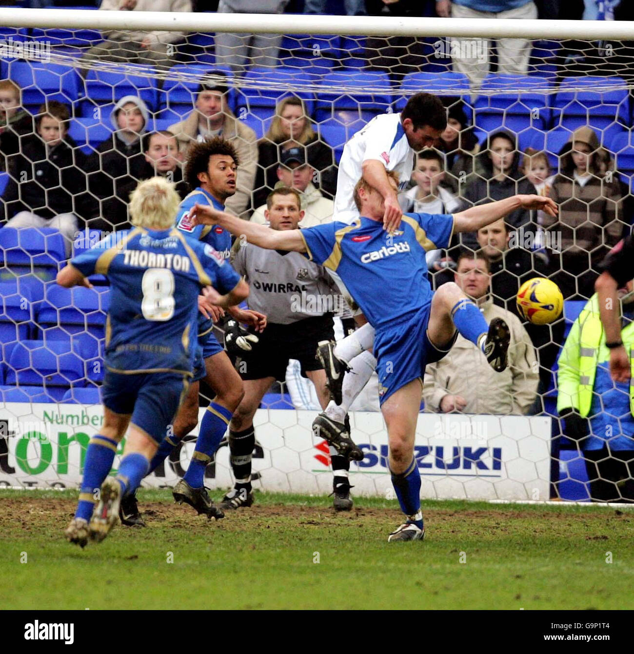 Tranmere's Chris McCready (second from right) climbs on Doncaster's ...
