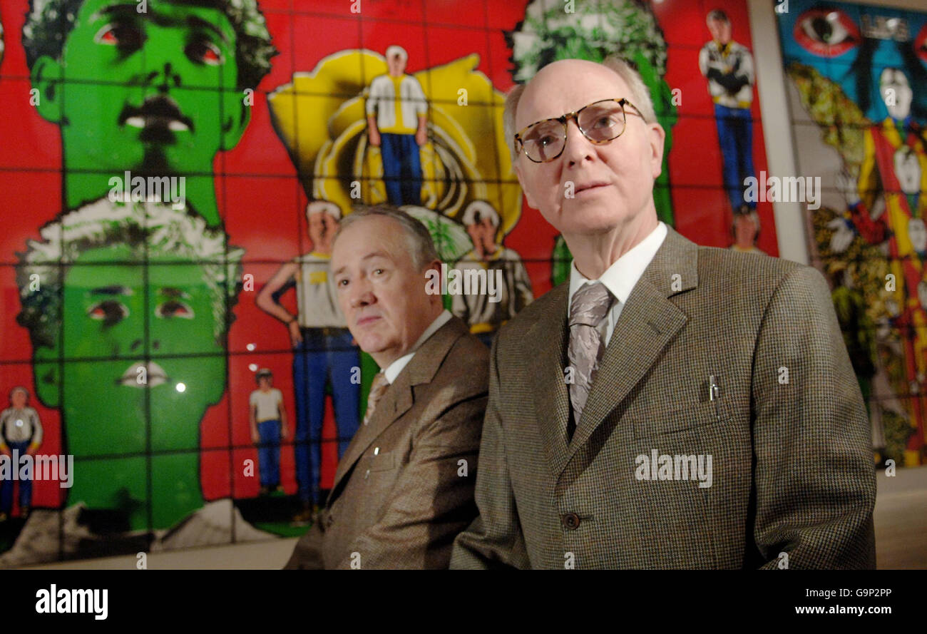 Artists Gilbert (left) and George pose in front of one of their ...
