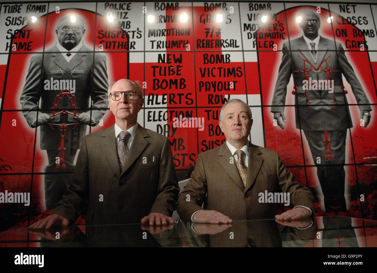 Artists Gilbert (right) and George pose in front of one of their ...