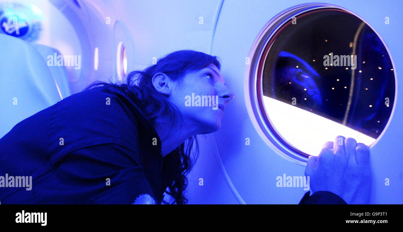 Models sit in the Virgin prototype model of the world's first tourist ...