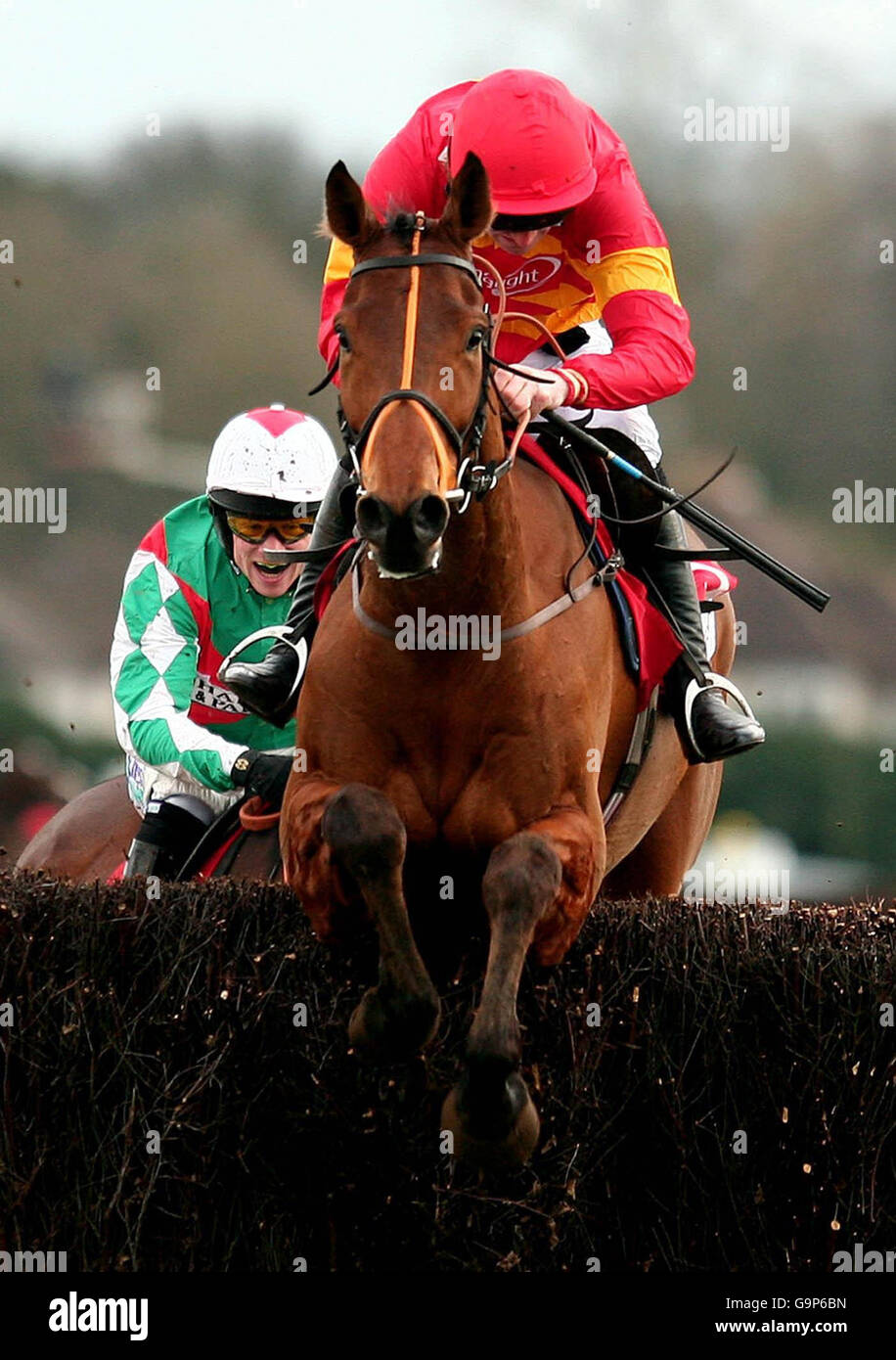 Horse Racing - Kempton Park. Natal, ridden by Ruby Walsh goes over the ...