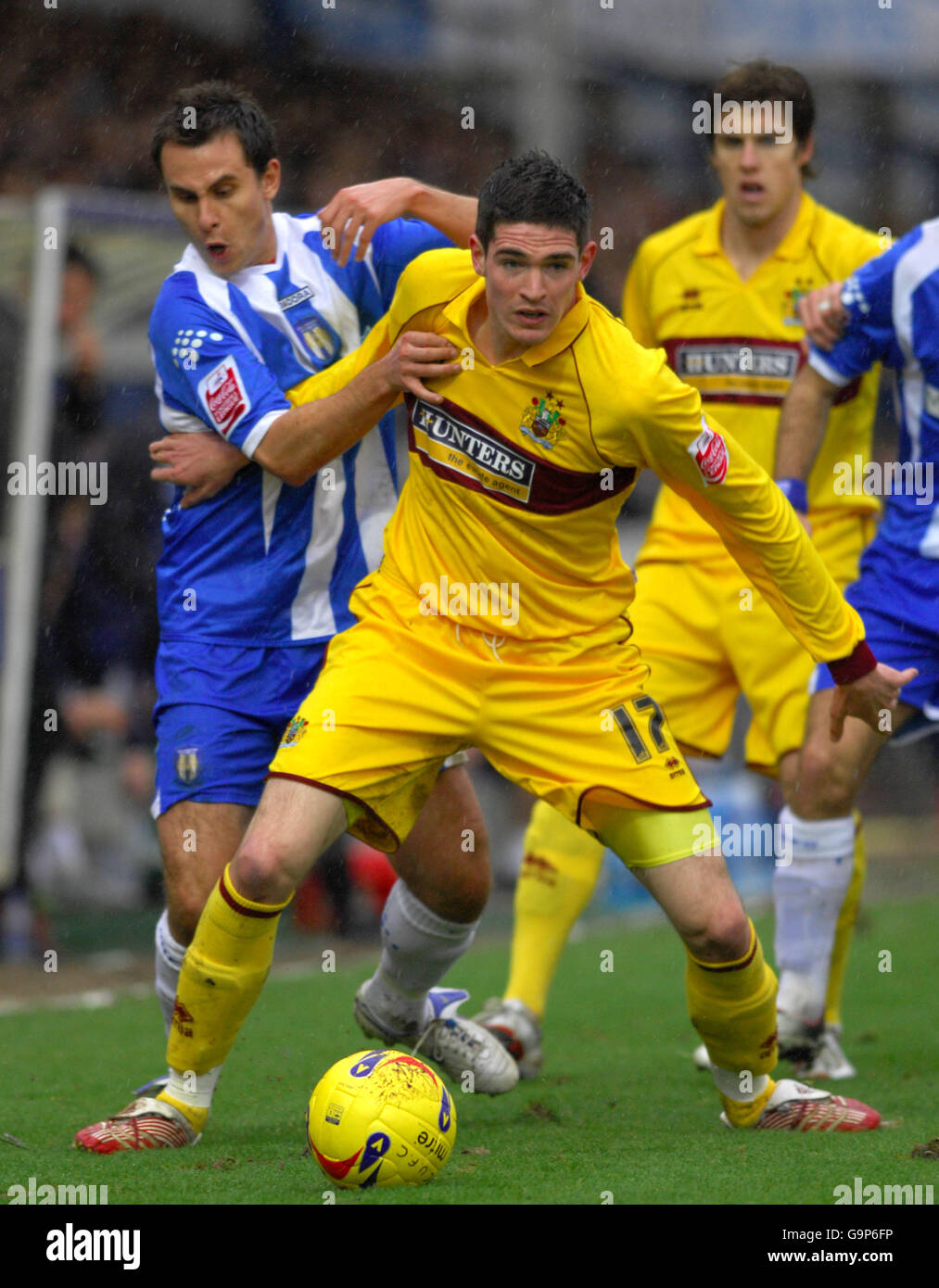Colchester United's Richard Garcia and Burnley's Kyle Lafferty battle ...