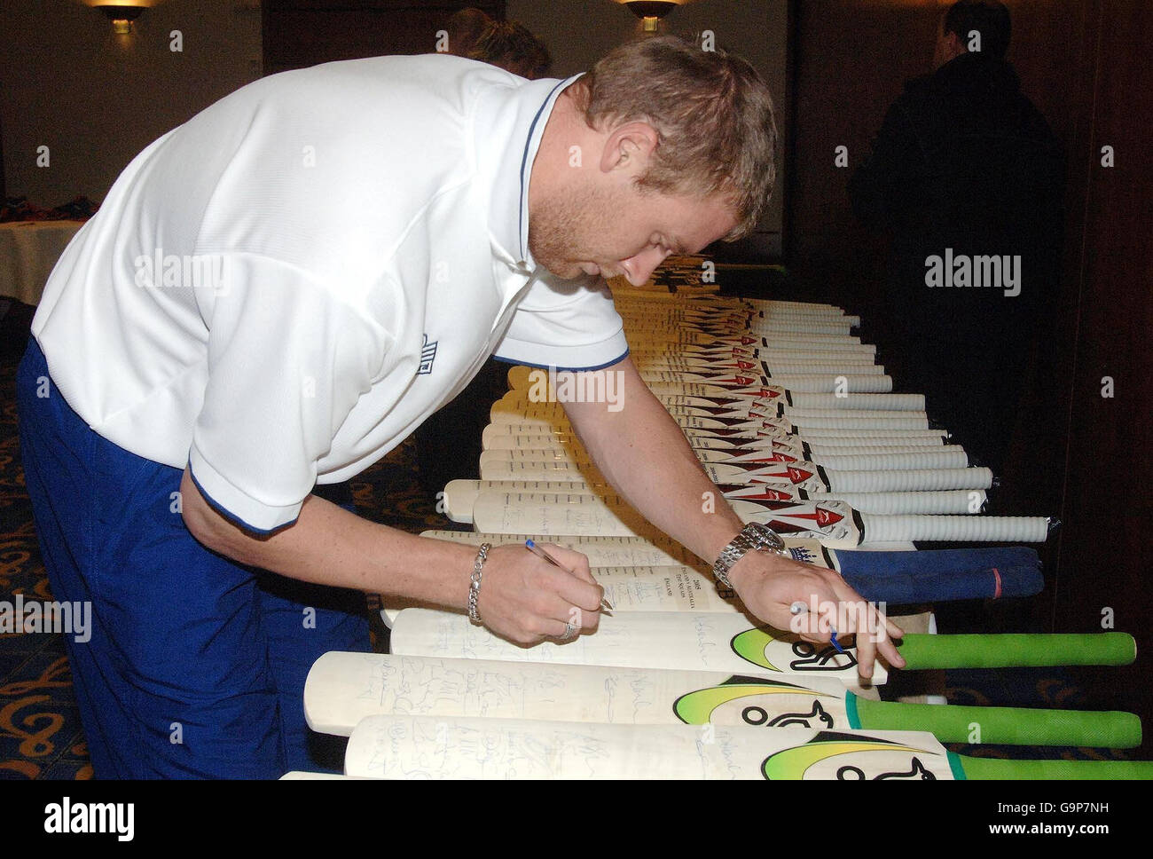 England's Andrew Flintoff signs cricket bats at the Sofitel Hotel ...