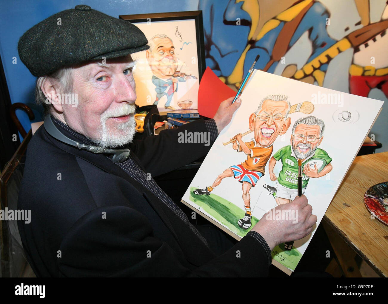 Artist Ray Sherlock puts the finishing touches to a political ...