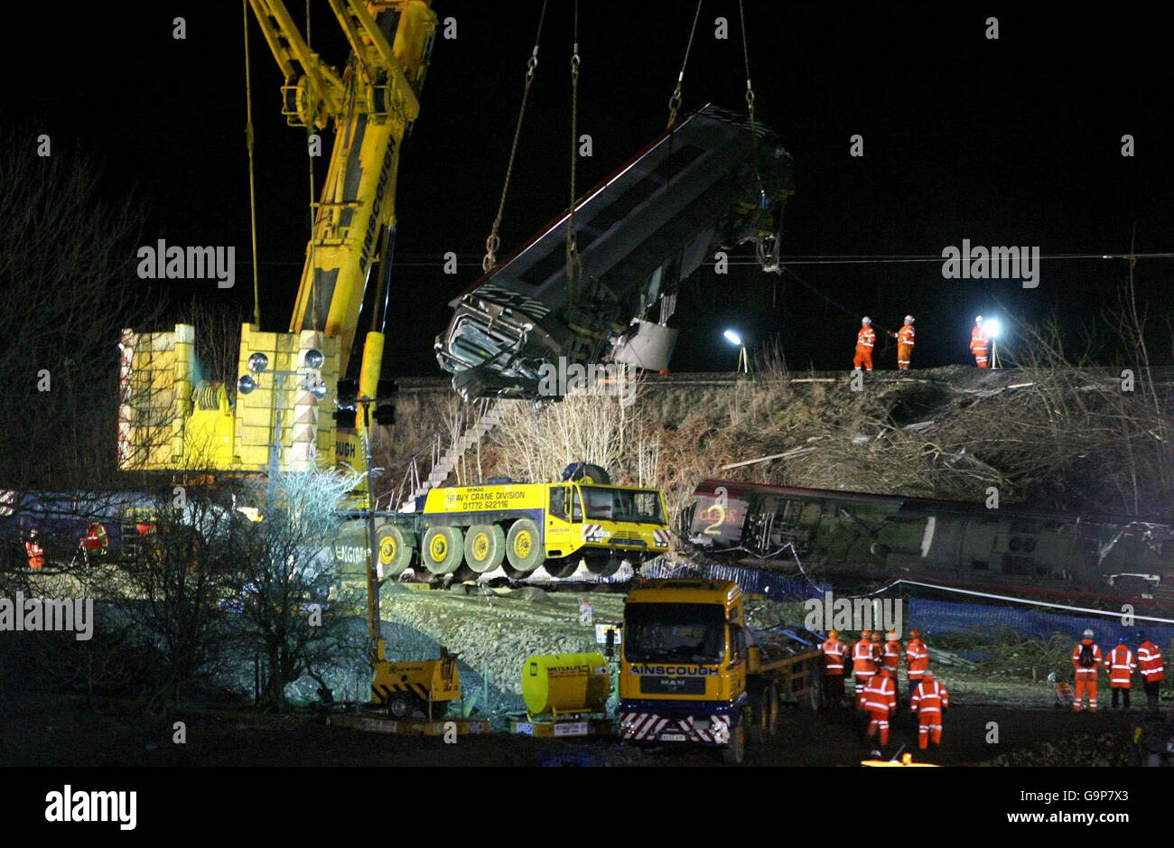 Virgin train crash. A crane lifts part of the Virgin train, which ...