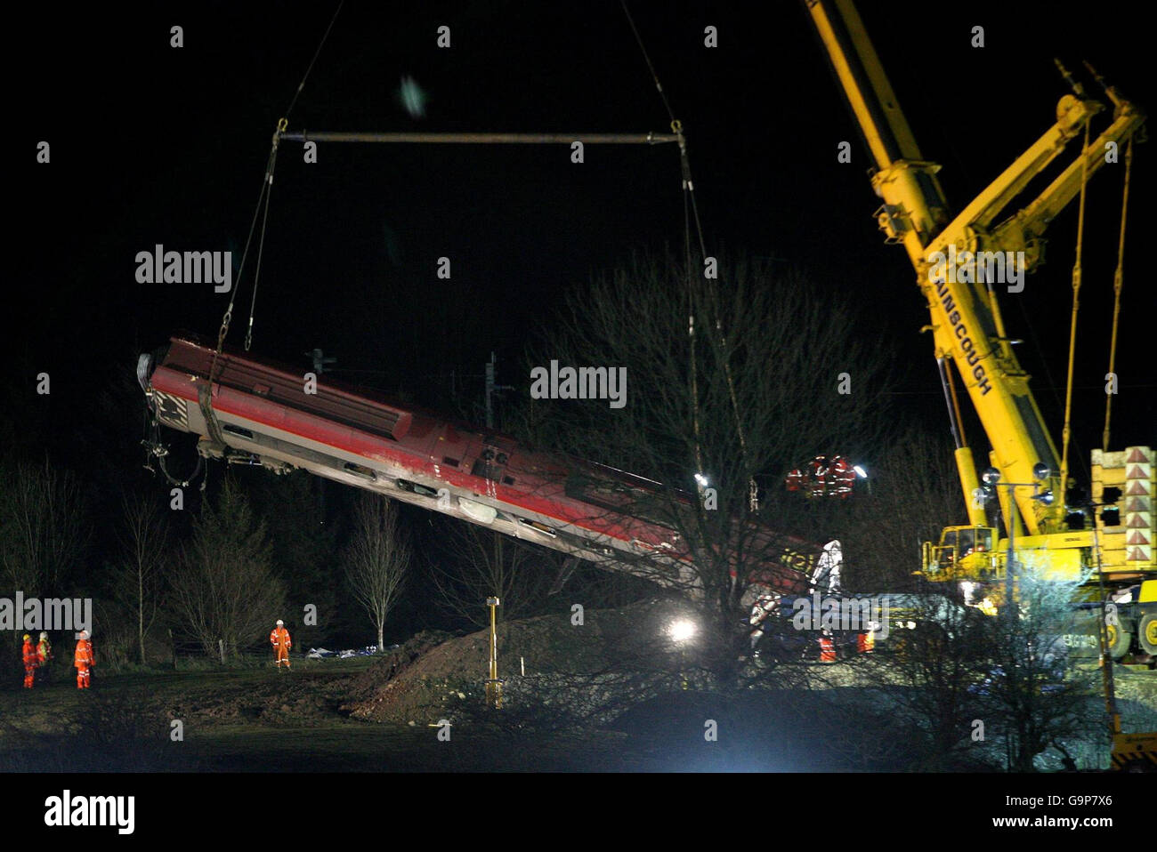 Virgin train crash. A crane lifts part of the Virgin train, which ...