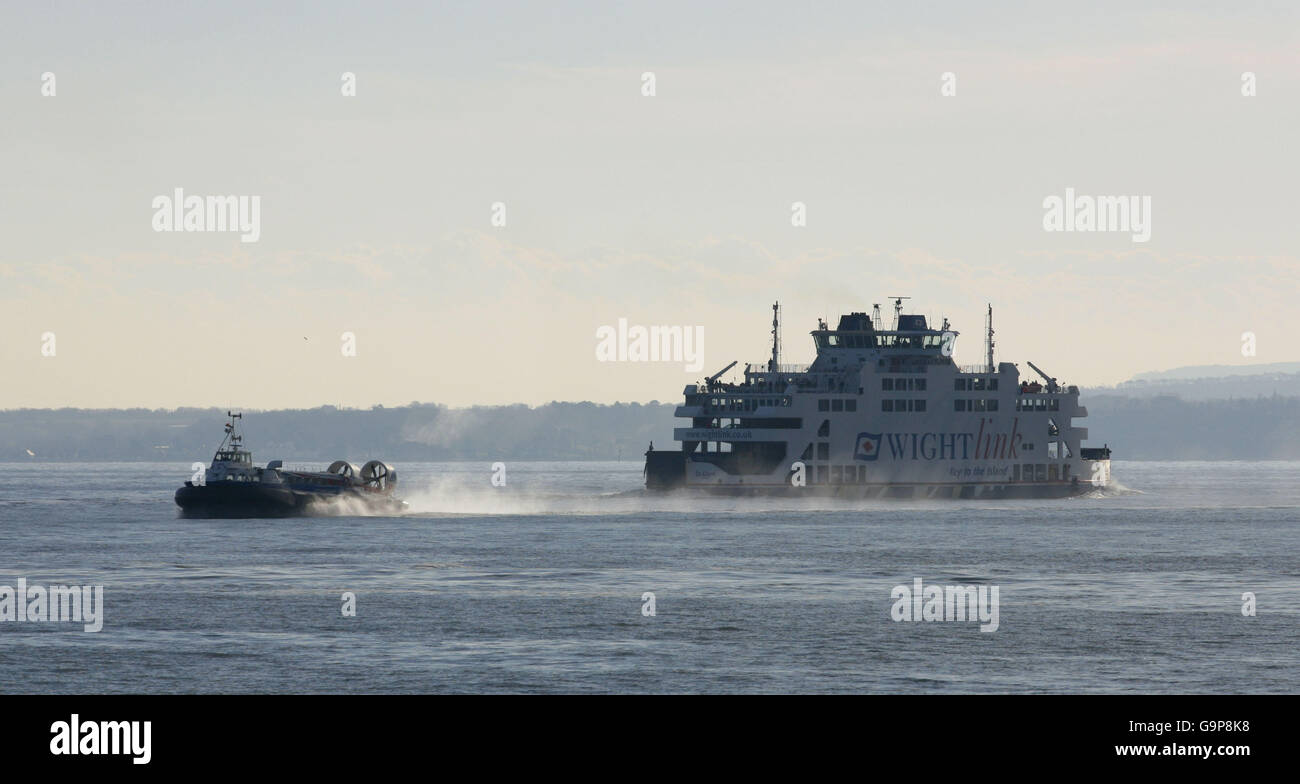 One of Hovertravel's two hovercraft passes a Wightlink ferry as they ...