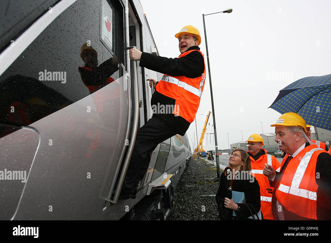 Minister for Transport Martin Cullen climbing into the cabin of the new ...