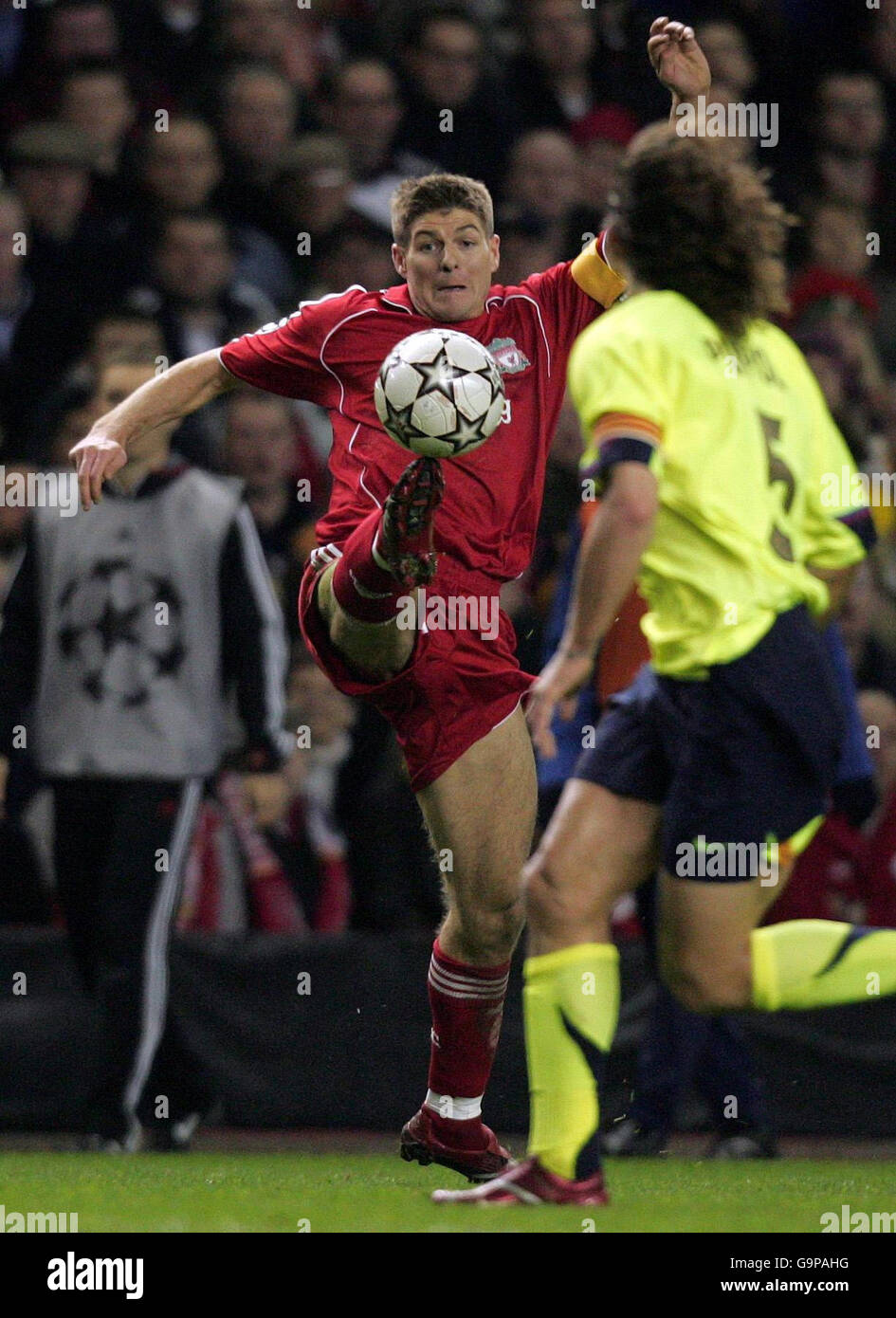 Liverpool's Steven Gerrard (left) battles with Barcelona's Carles Puyol ...