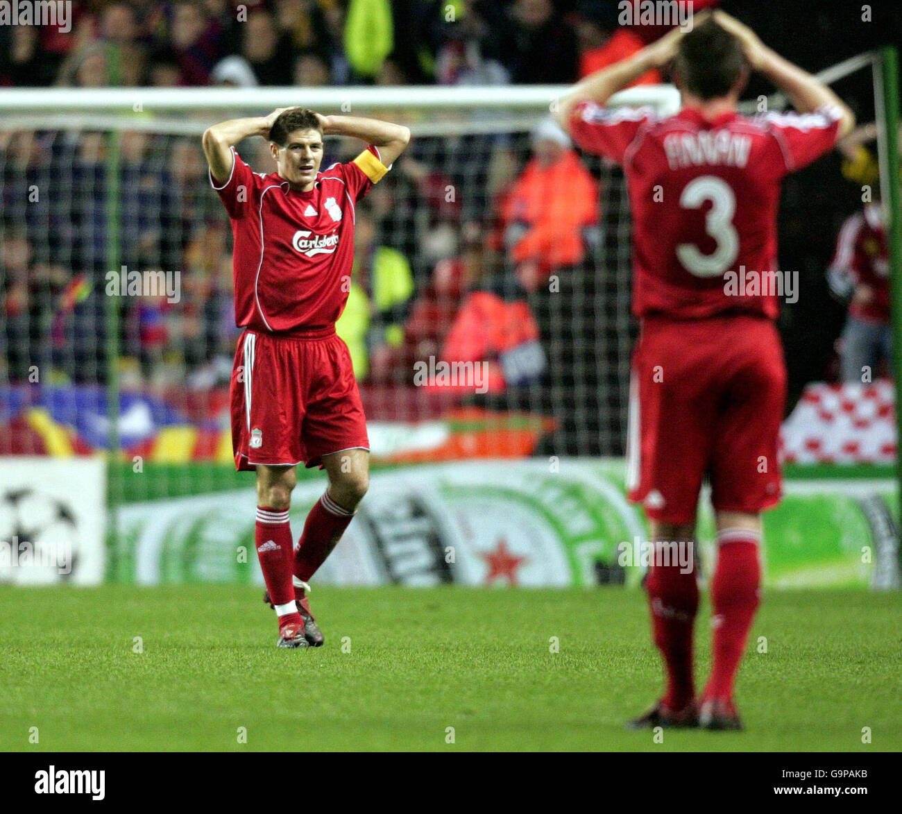 Liverpool's Steven Gerrard (left) and Steve Finnan stand dejected ...