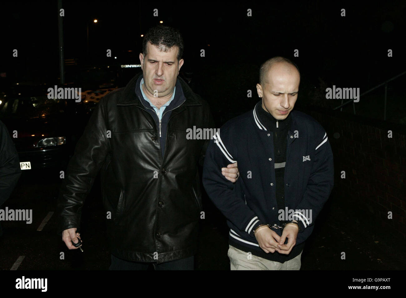 Polish national Daniel Bankowski, 23, (right) is arrested by a ...