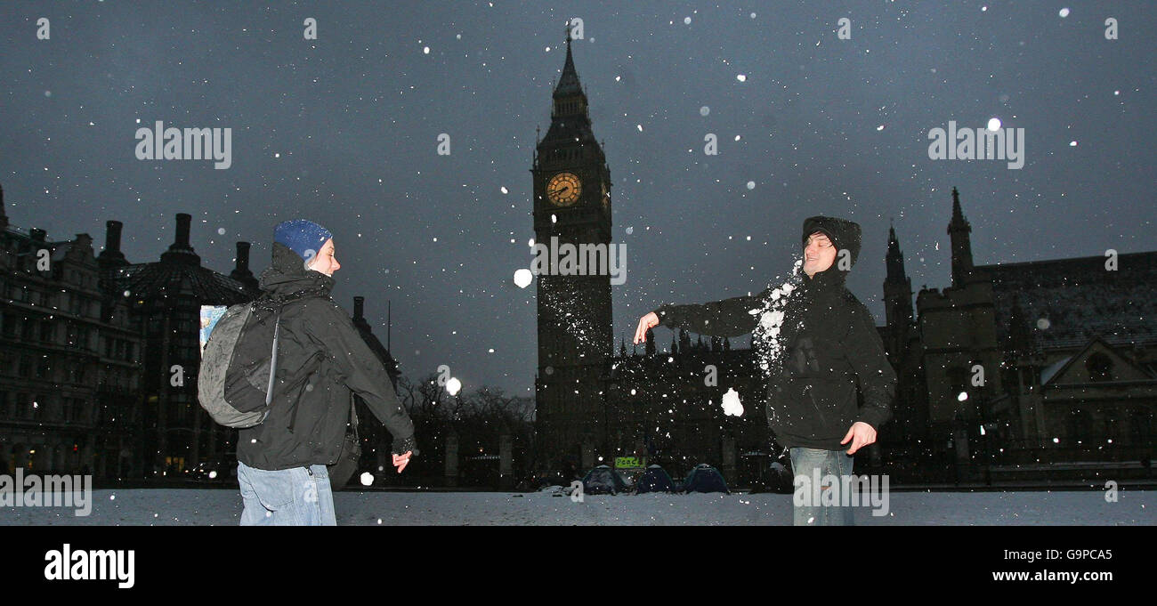 People have a snowball fight in Parliament Square in London during a ...