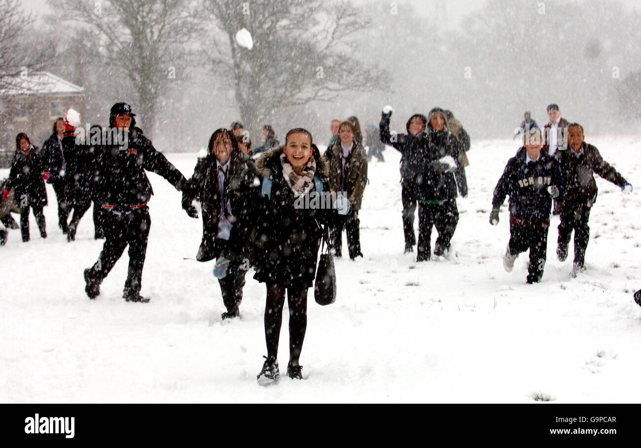 Children have a snowball fight on their way to school in Wanstead ...