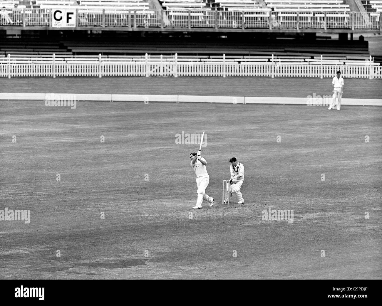 Rupert Webb of Sussex hits a ball from H. W Tilley during the match ...