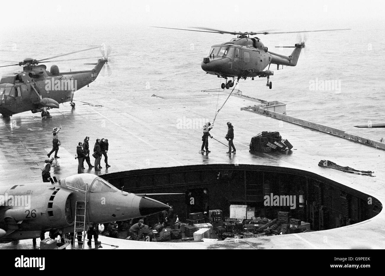 Small arms ammunition and stores from HMS Brilliant are air-lifted ...