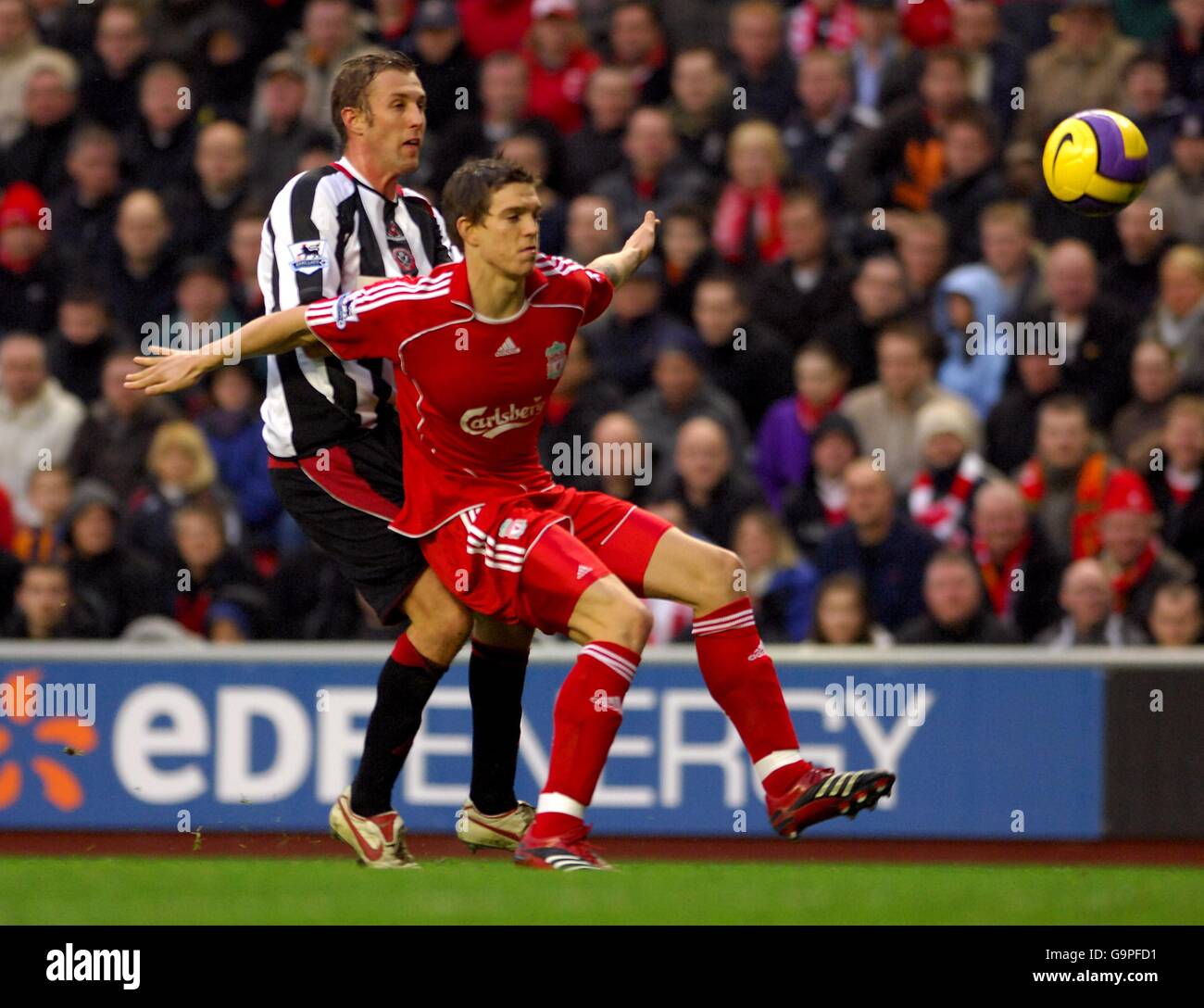 Sheffield United's Rob Hulse and Liverpool's Daniel Agger battle for ...