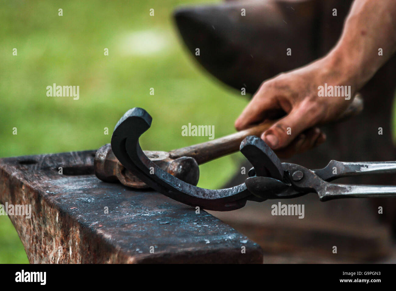 Blacksmith working very hard Stock Photo - Alamy