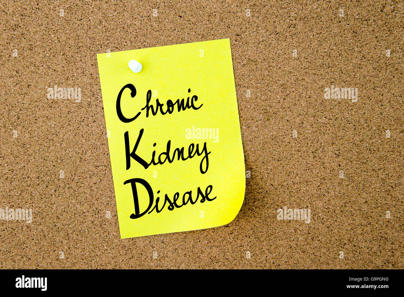CKD Chronic Kidney Disease written on yellow paper note pinned on cork ...