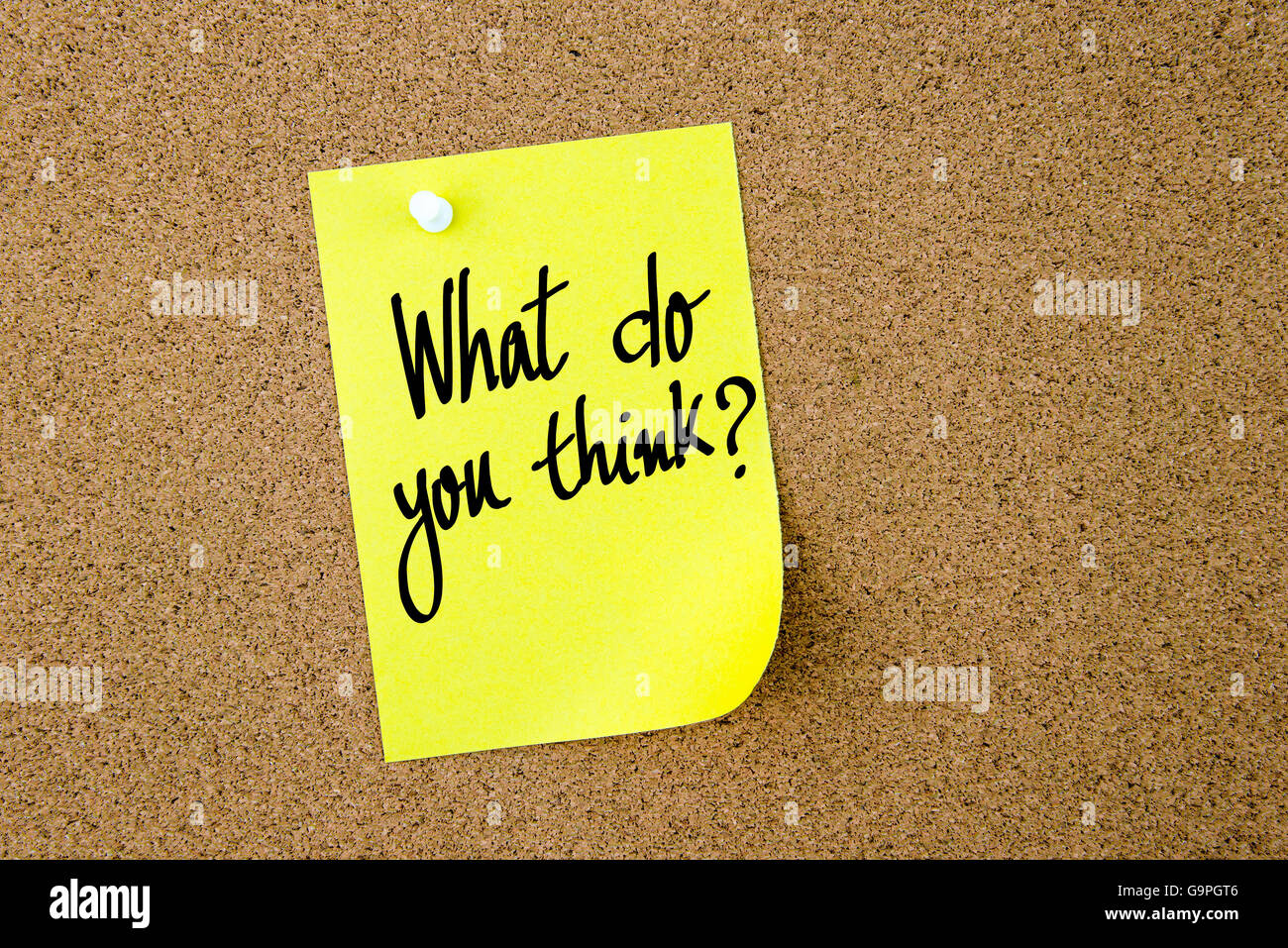 What Do You Think ? written on yellow paper note pinned on cork board ...