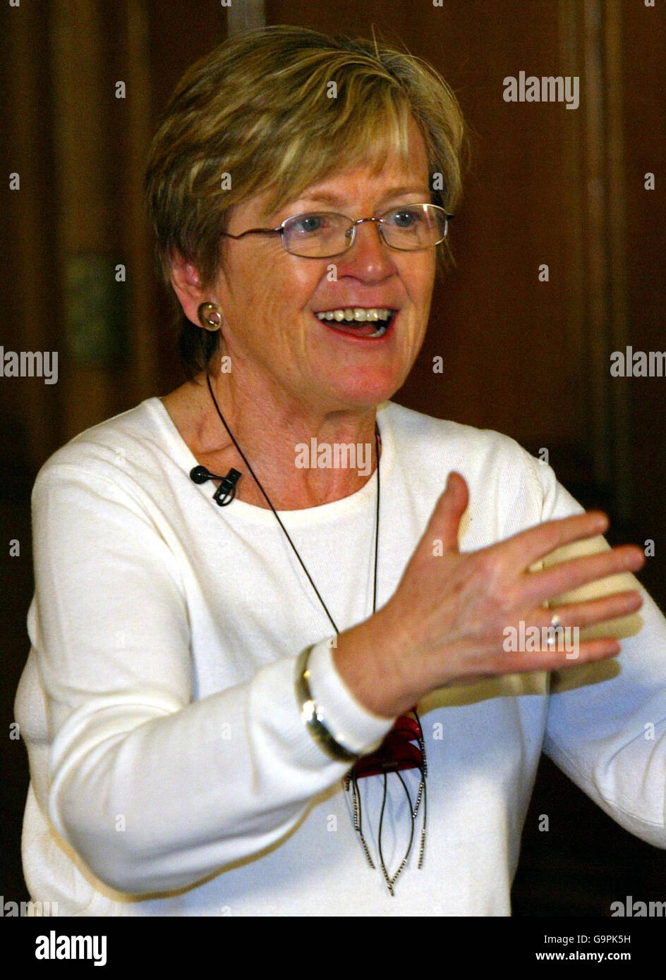 Half length mid top speaking smiling smile gesturing gesture ...