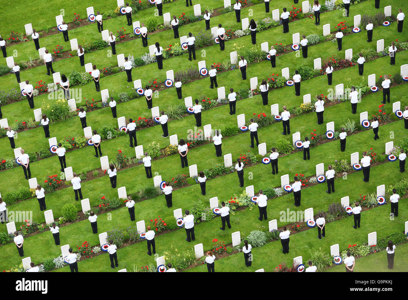 Young people lay wreaths during a service to mark the 100th anniversary ...