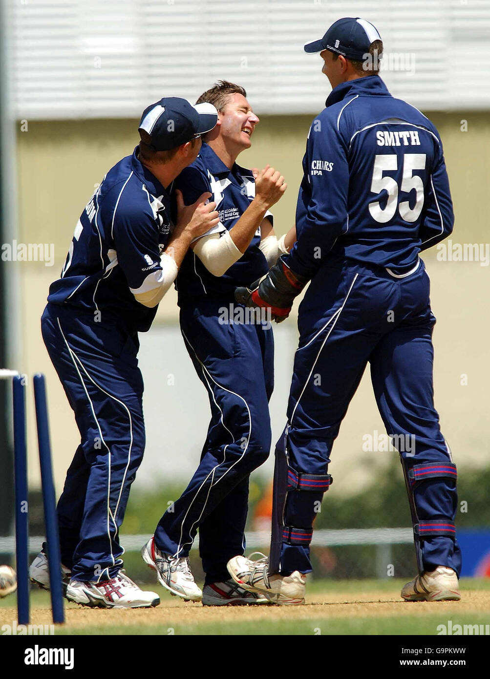 Scotland's Glenn Rogers and Neil McCallum (left) celebrate the wicket ...
