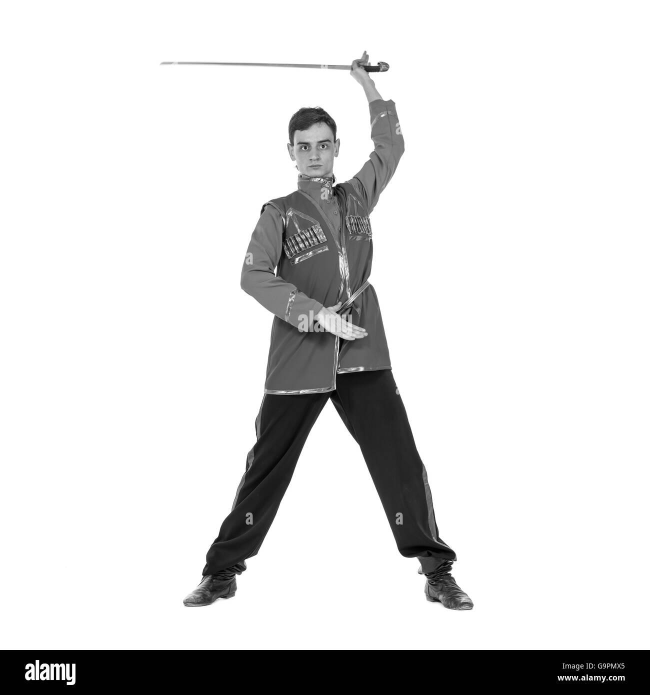 colorless full length portrait of Russian cossack dance. Young dancer ...