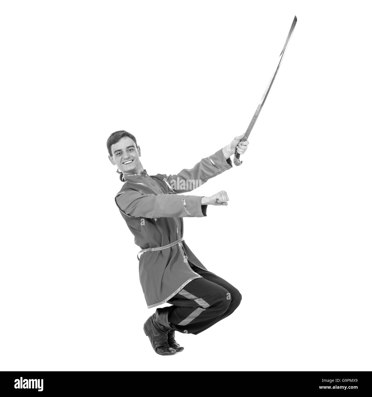 colorless full length portrait of Russian cossack dance. Young dancer ...