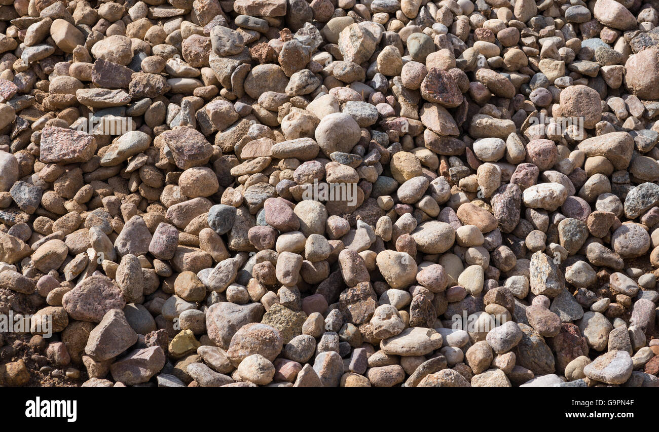 Big pile of stones as a background Stock Photo - Alamy