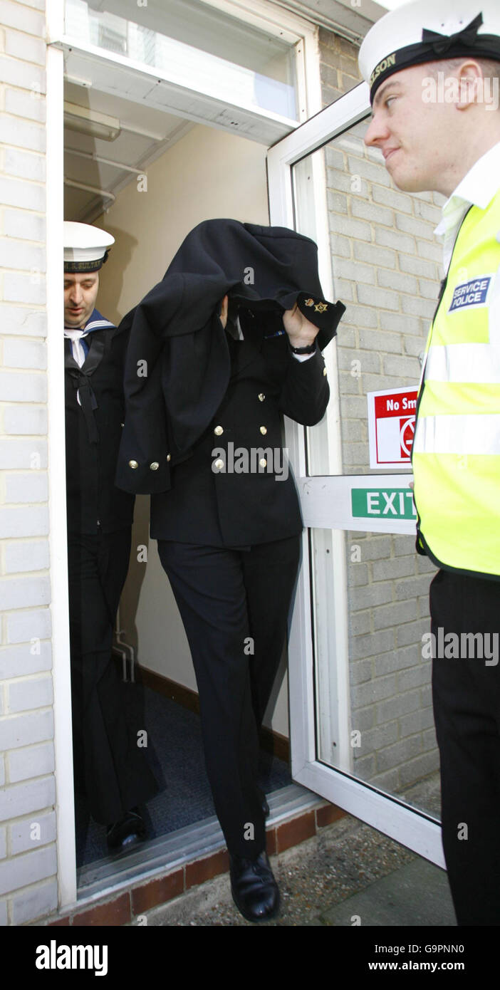 Royal Navy Chief Petty Officer Phillip Coates hides under a borrowed ...